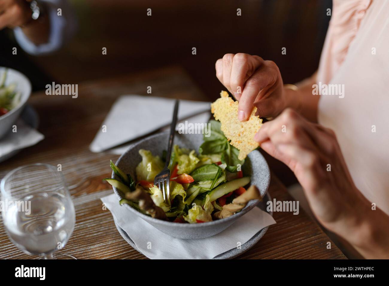Close up of vegetable salad serving in restaurant, customer eating ...
