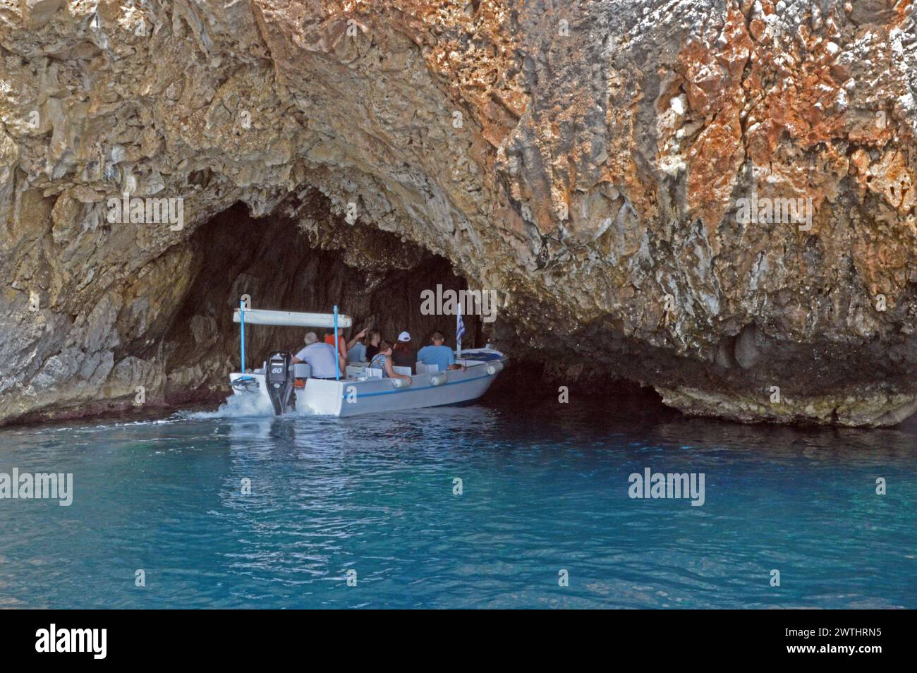 Greece, Island of Corfu, Paleokastritsa: pleasure boat exploring the ...