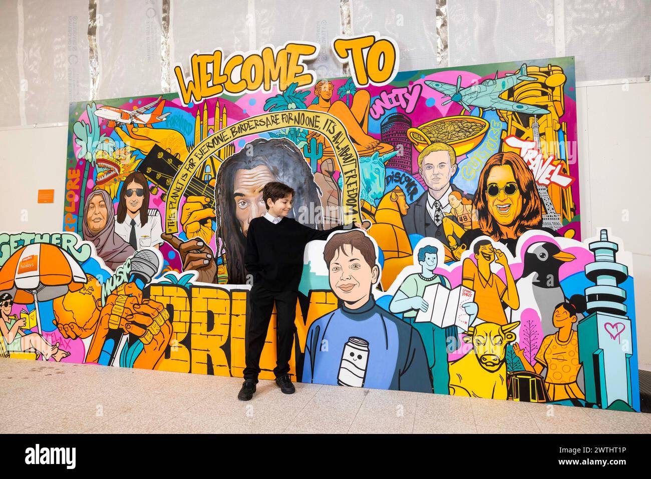 EDITORIAL USE ONLY Community hero Ryan Hulance in front of his portrait ...