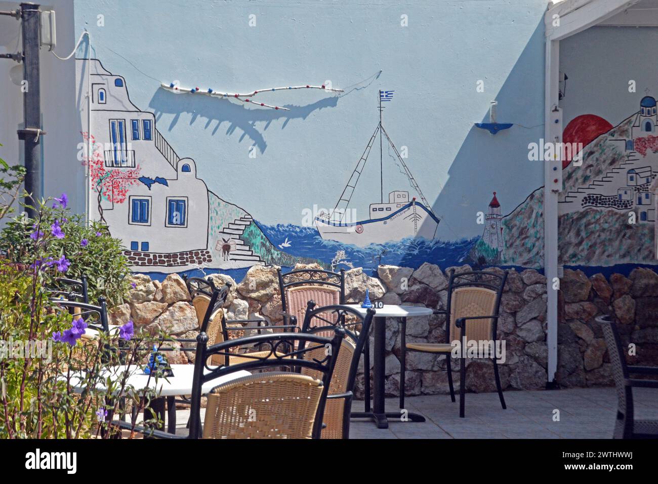 Greece, Island of Tilos: street restaurant in Liviados with appropriate ...