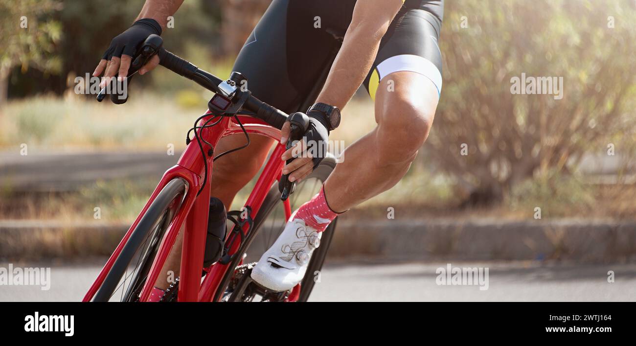 Road bike cyclist man cycling, athlete on a race cycle. Leaning into a ...