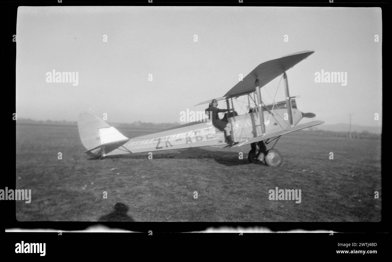 James Frederick Cane climbing into plane black-and-white negatives ...