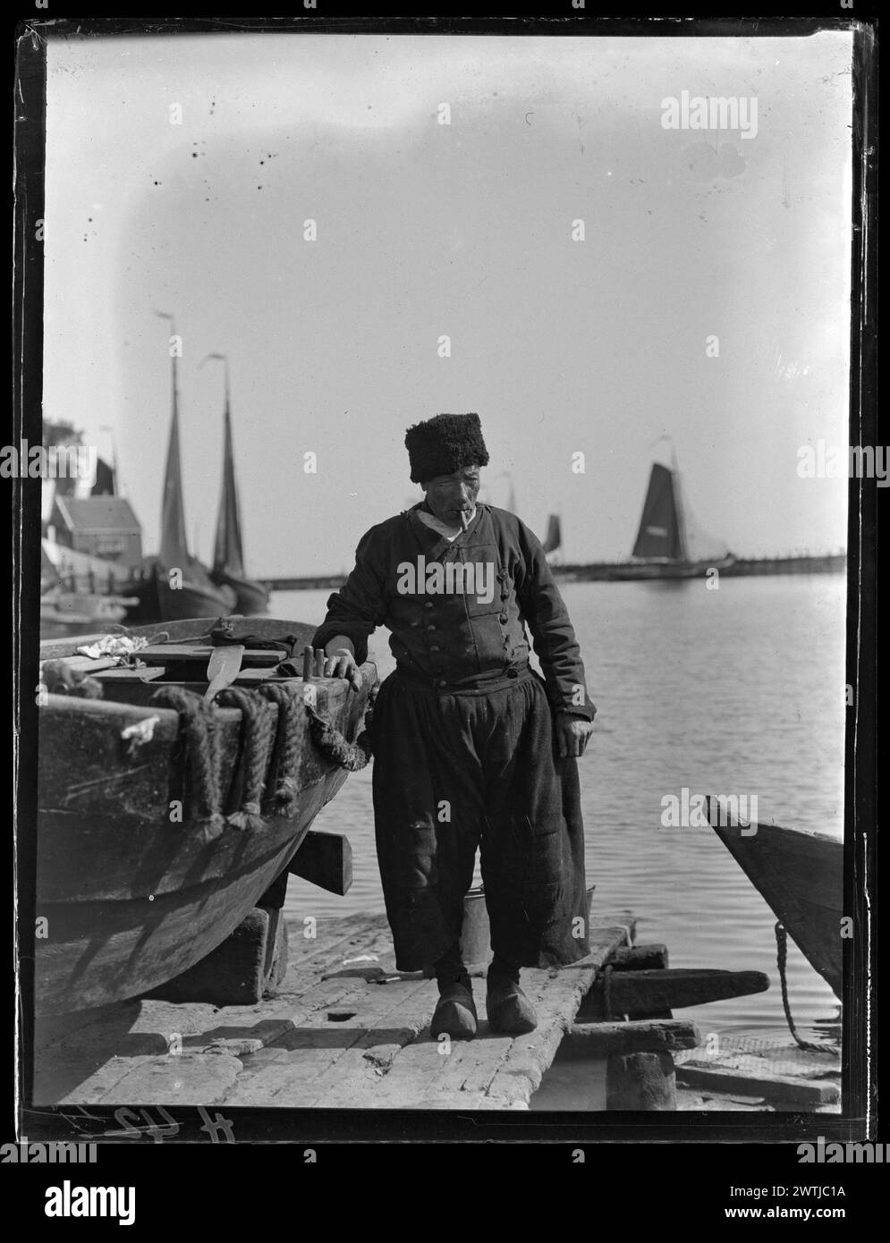 Man standing beside a boat, the Netherlands gelatin dry plate negatives ...