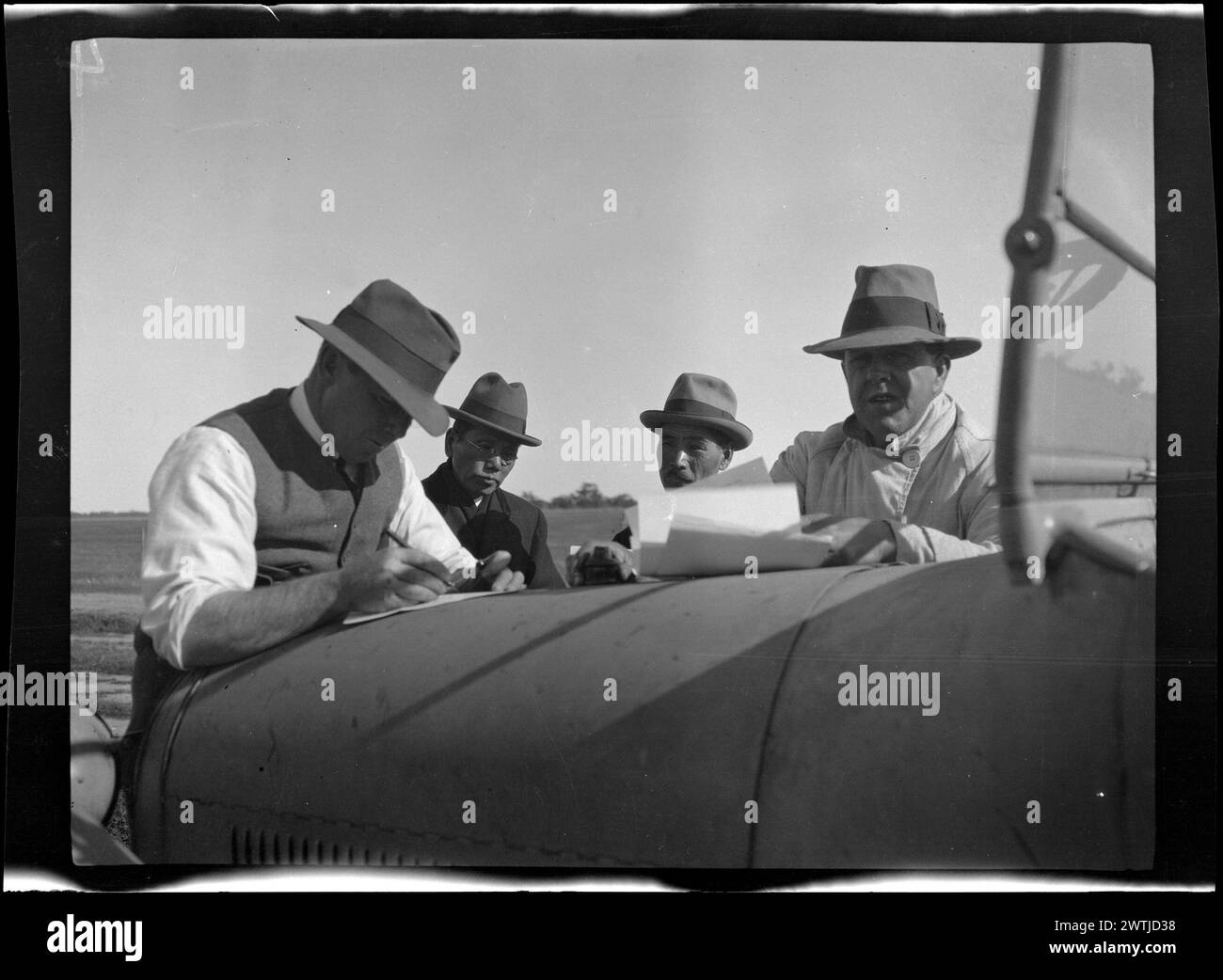 Four men Nitrate negatives, black-and-white negatives Stock Photo - Alamy