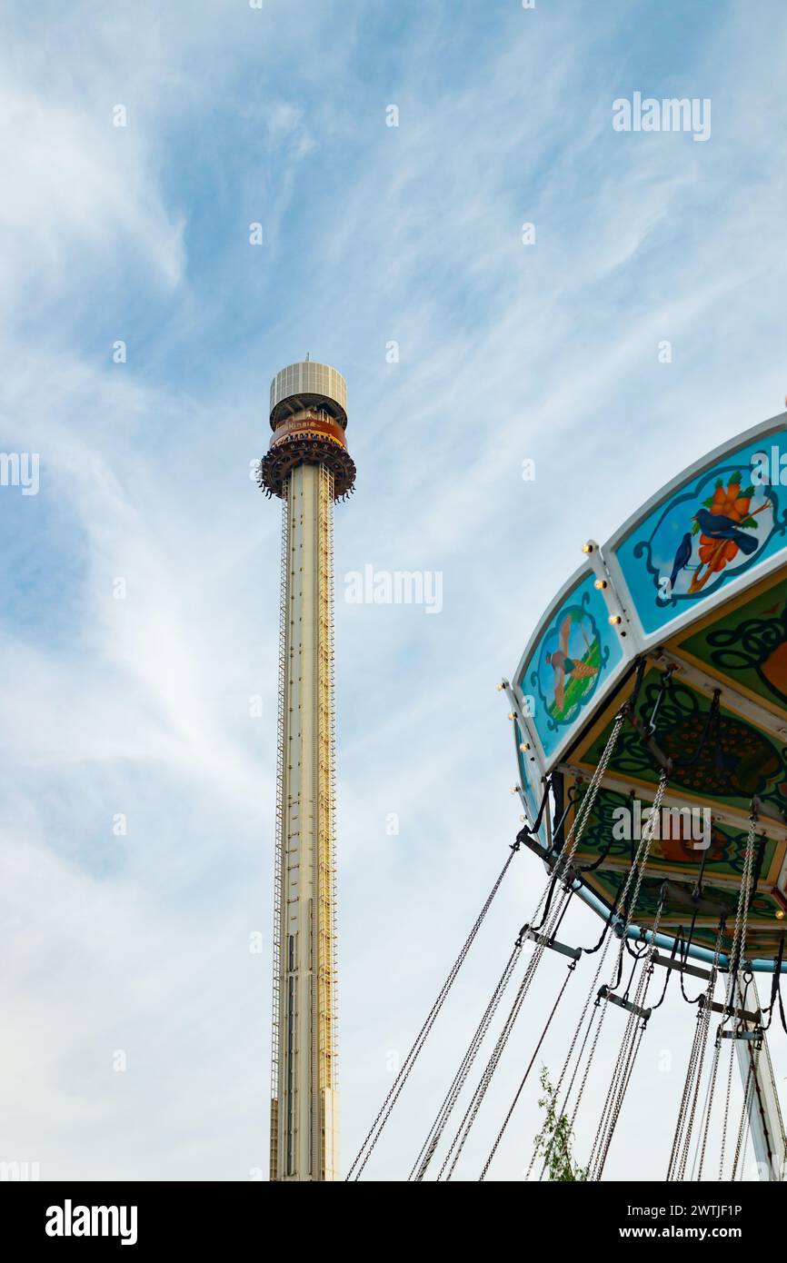 Helsinki, Finland - 21 May 2023: rides tower Kingi and carousel Ketjukaruselli in motion in ...