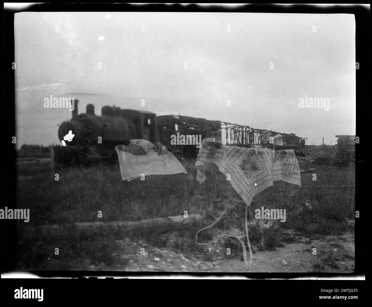 Odd image of train and table gelatin silver negatives, black-and-white ...