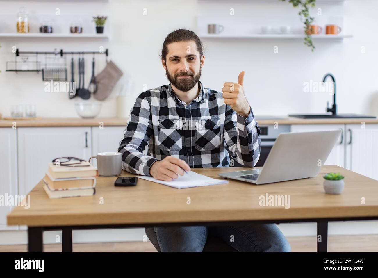 Consultant offering guidance to clients over platform from home, thumb ...