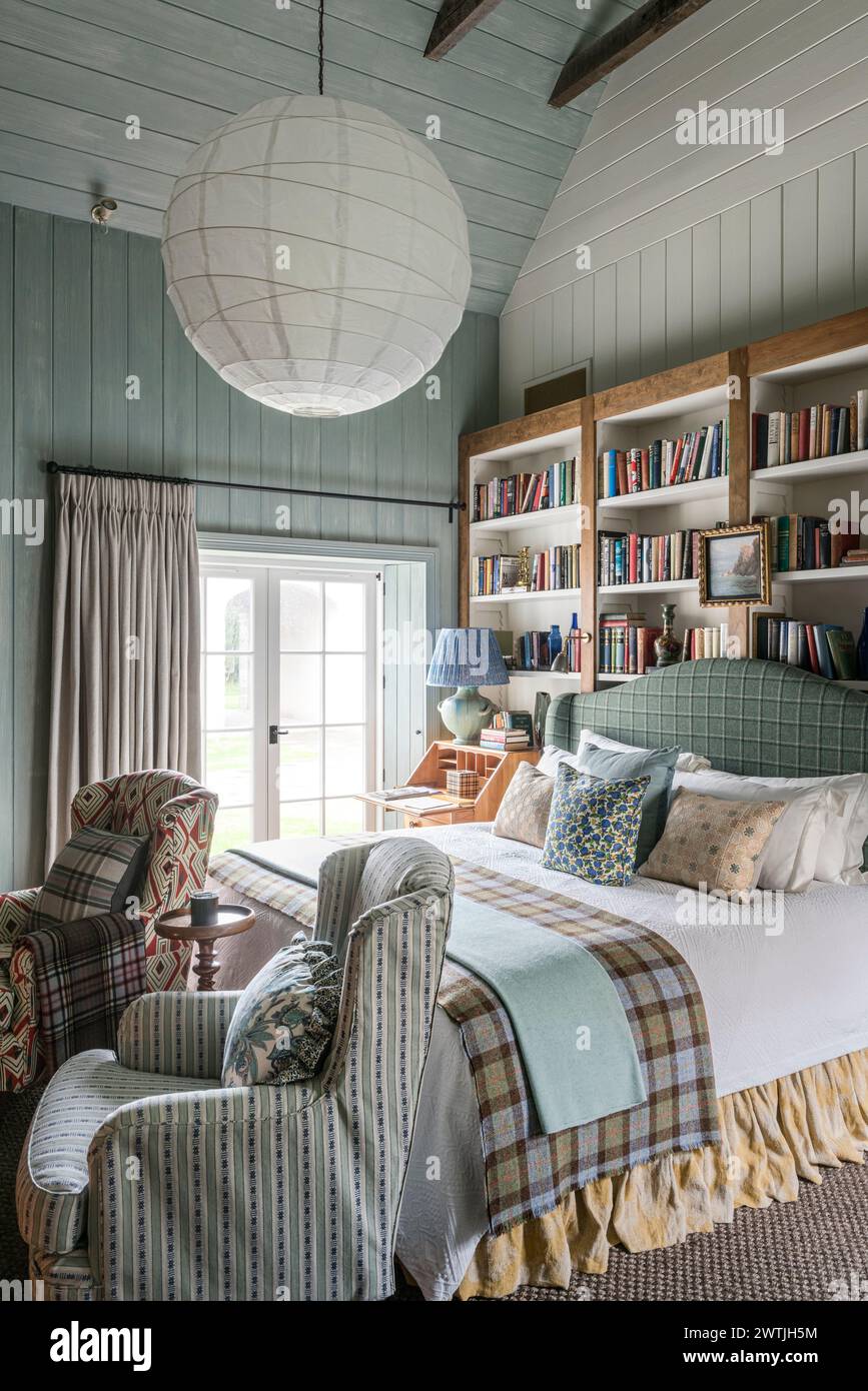 Large paper shade above bed with two armchairs in luxury hotel in ...