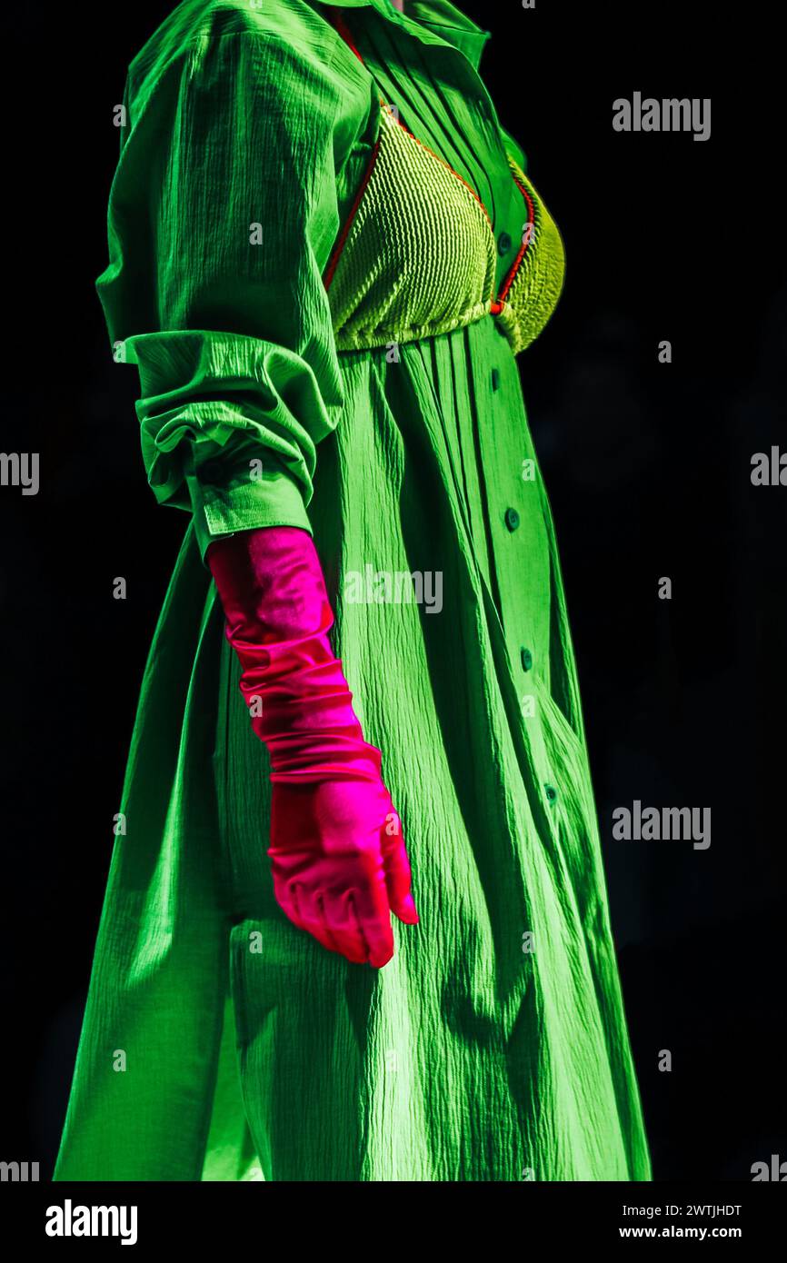 Interesting creative bright outfit green dress, pink gloves on black ...