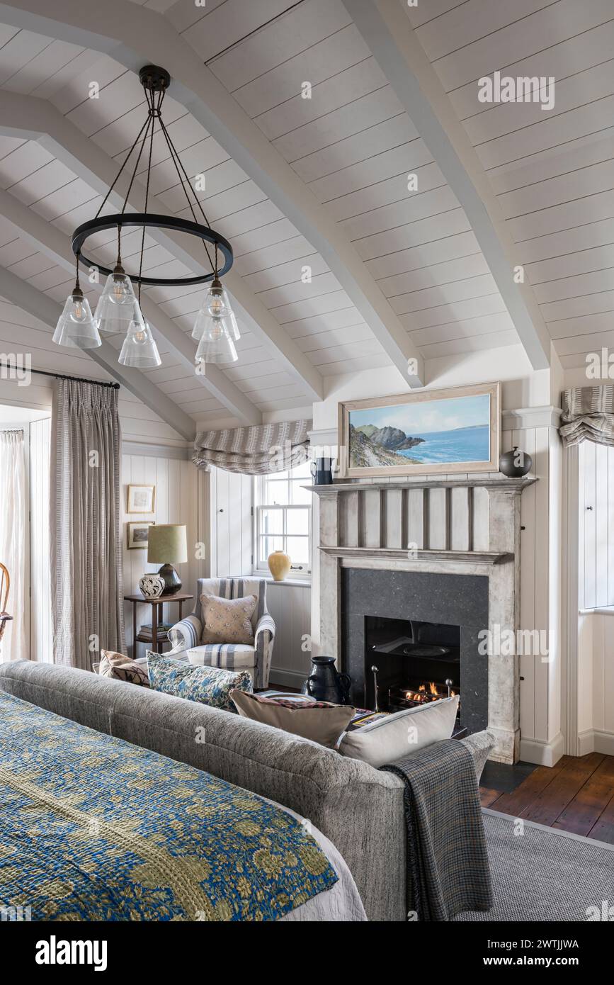 Glass pendant light hangs from architectural ceiling in luxury hotel in ...