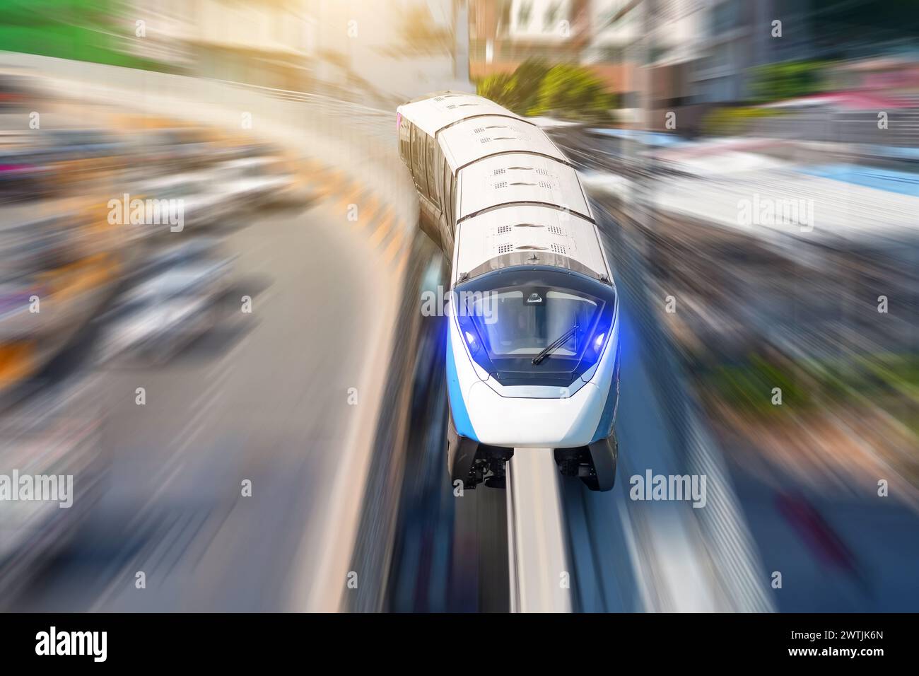 Aerial top view modern high speed monorail train with bright headlights ...