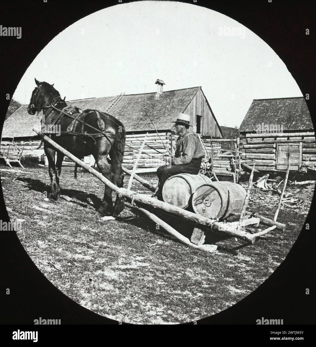 Wet collodion transparency - animal drawn sled, transporting barrels ...