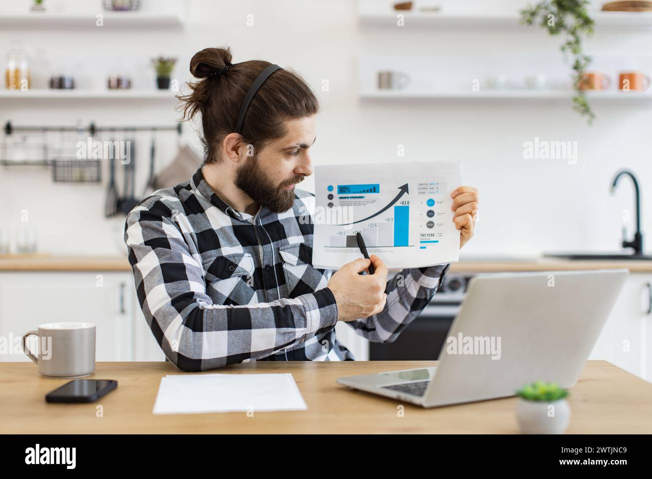 Qualified data analyst demonstrating information about business growth ...