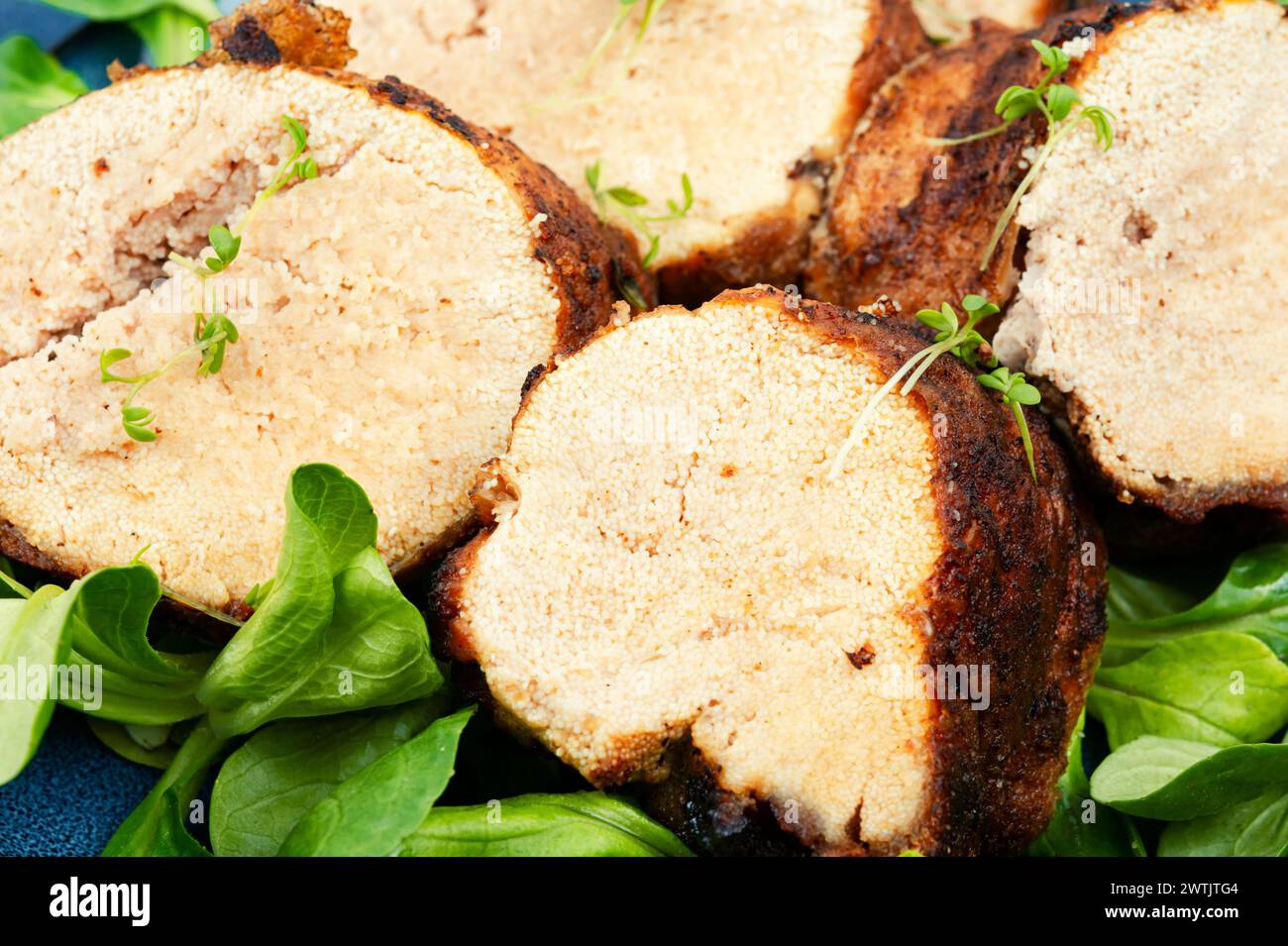 Roasted cod roe on a plate. Seafood and fish dishes Stock Photo - Alamy