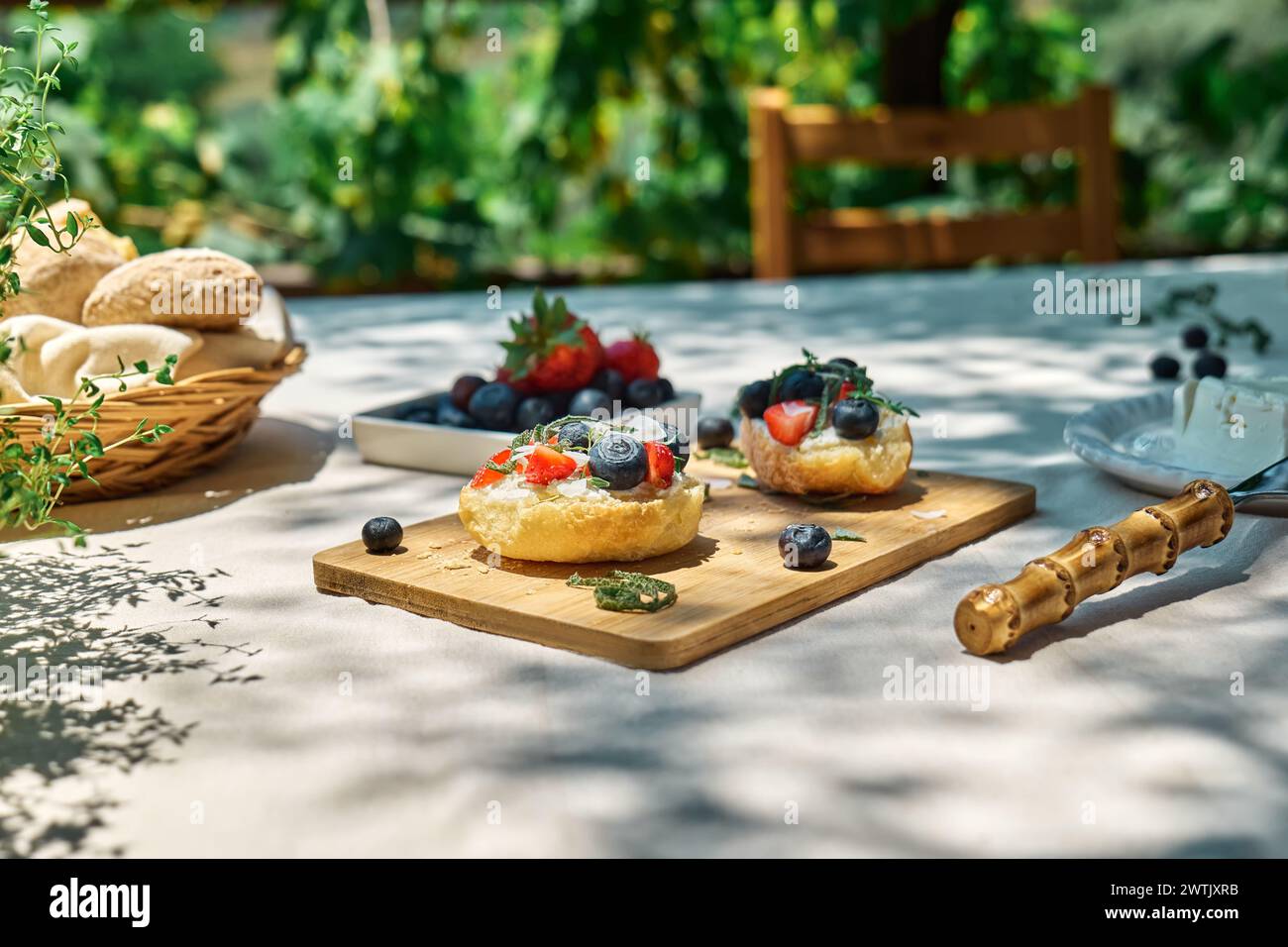 Toast with cream cheese, blueberry, strawberry, coconut flakes and ...