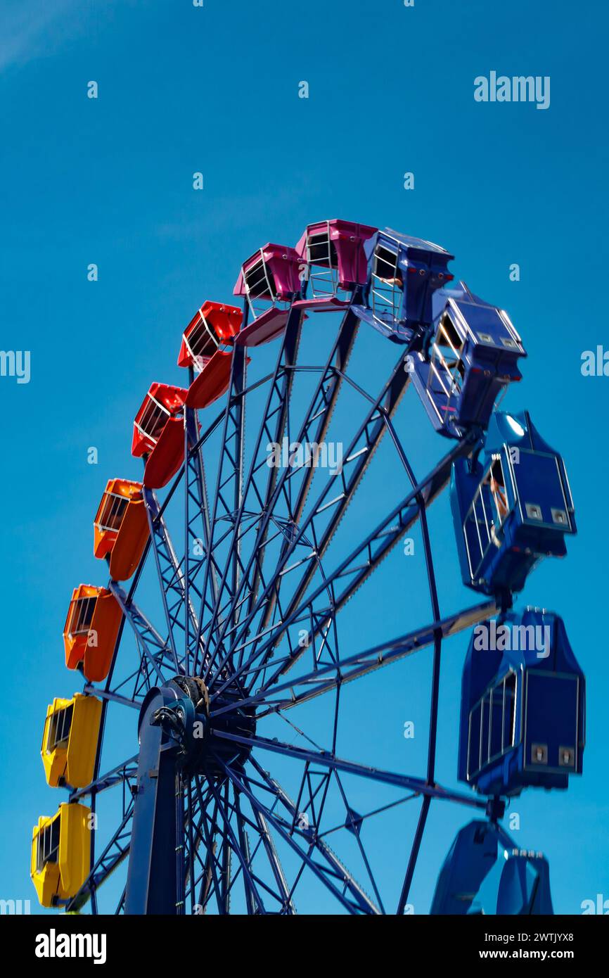 Colorful ride in motion in amusement park on sky background Stock Photo ...
