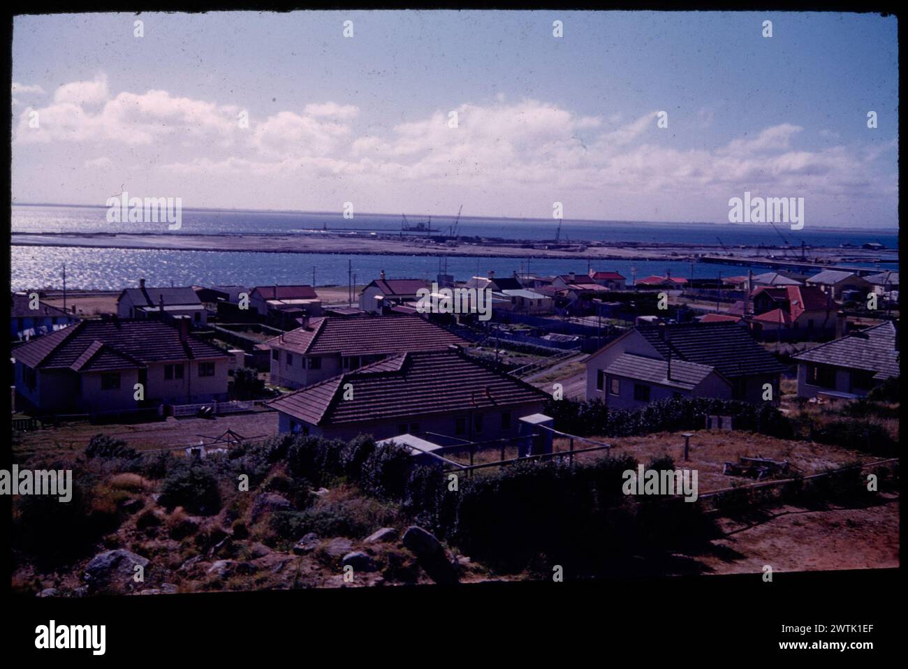 Panorama of the Bluff - town and harbour showing artificial island port ...