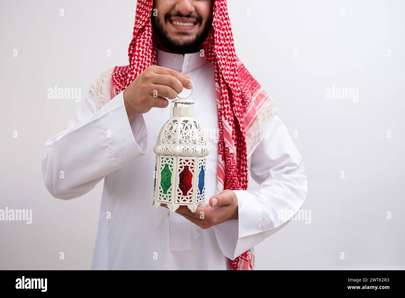 Draped in the dignified attire of Kandoura and Keffiyeh, an Arabic man ...