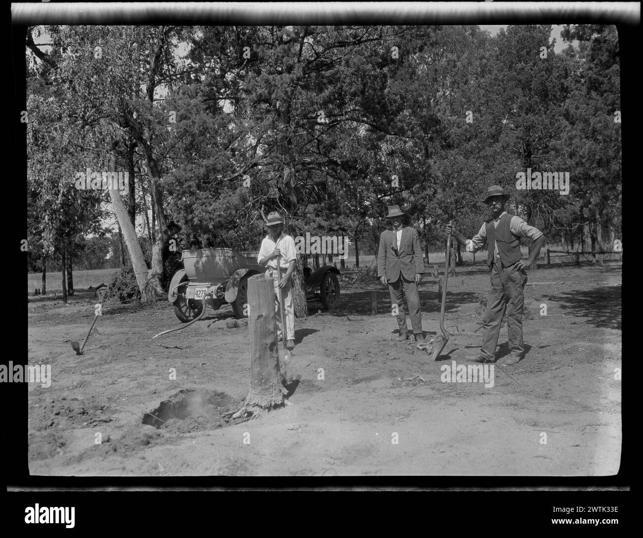 Men clearing a field gelatin silver negatives, black-and-white ...