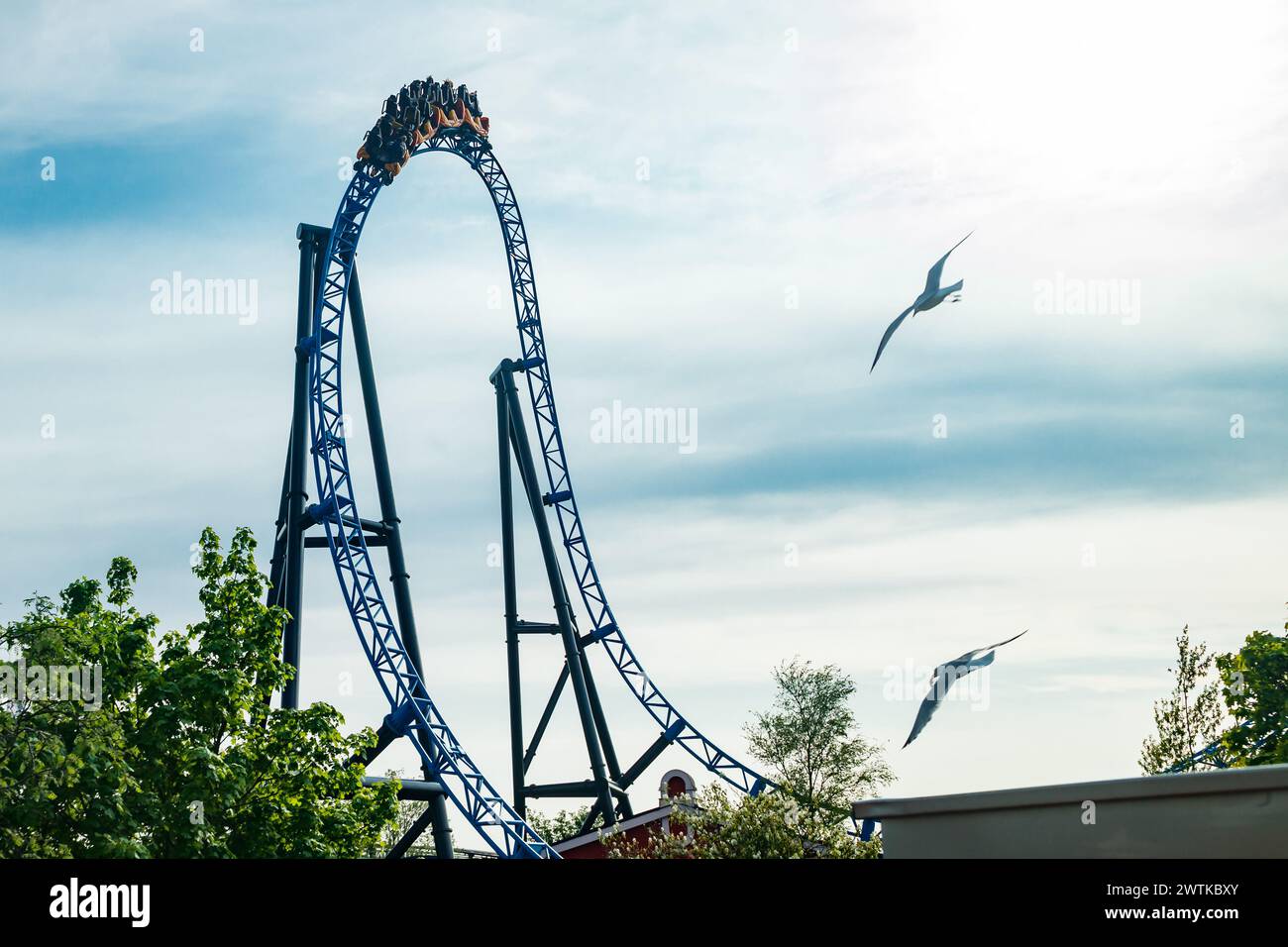 Ride roller coaster in motion on sky background in amusement park Stock ...