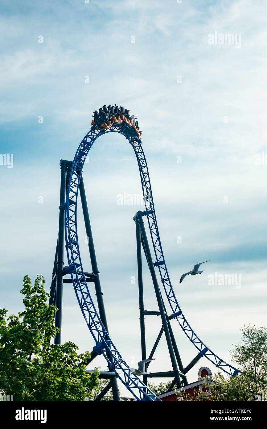 Ride roller coaster in motion on sky background in amusement park Stock ...