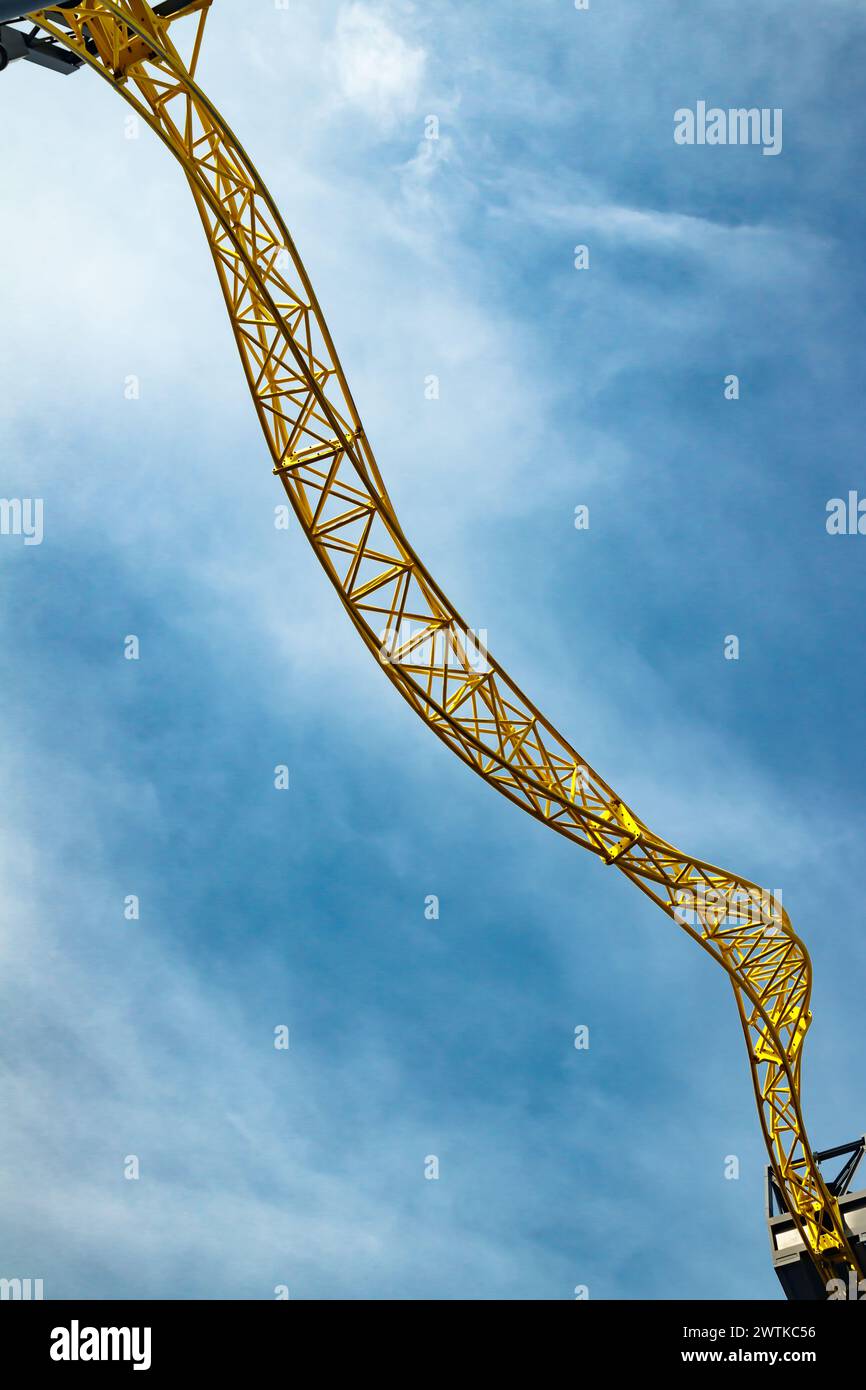 Empty ride roller coaster in amusement park on blue sky background ...