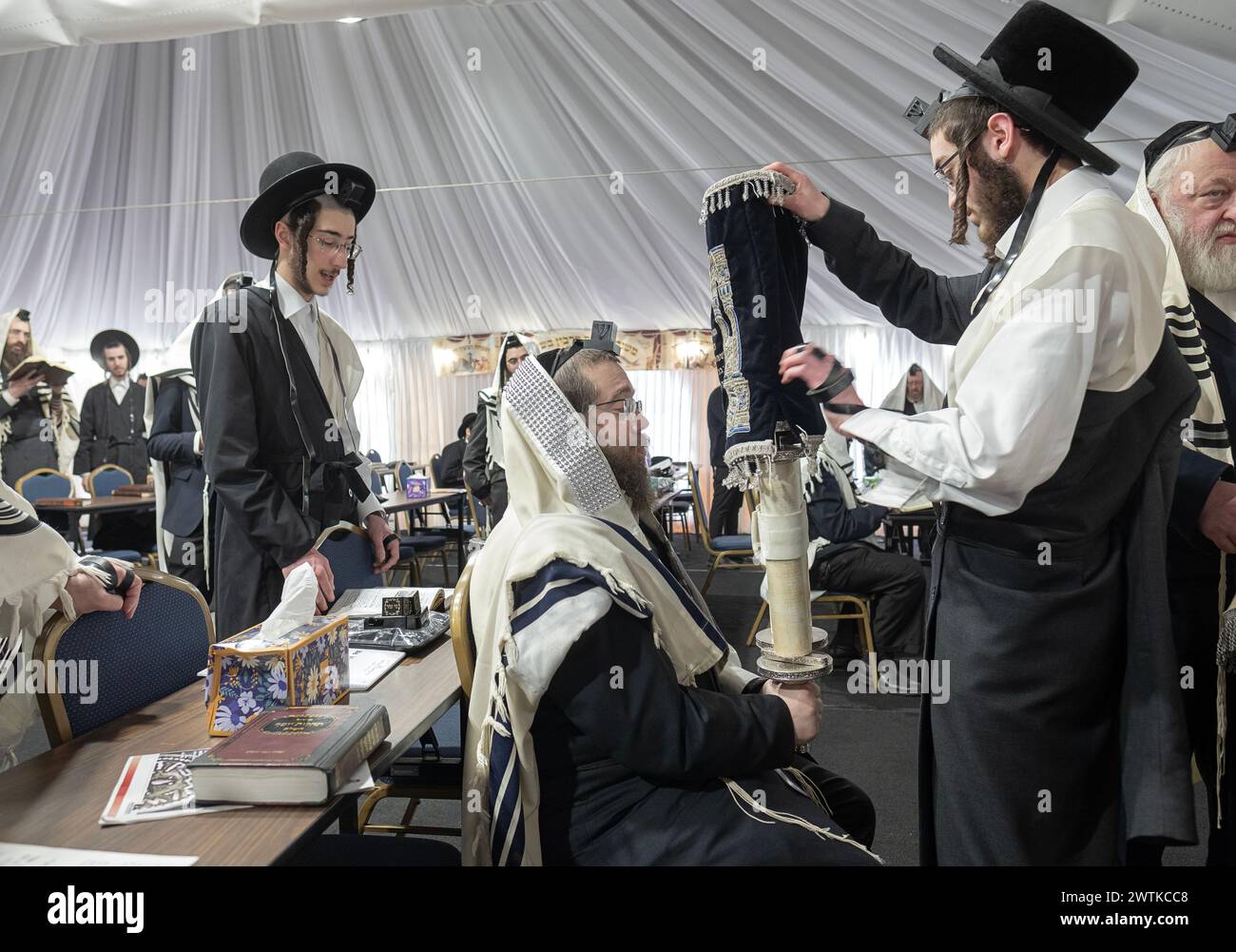 After a Torah reading the scroll is lifted, shown to the congregation ...