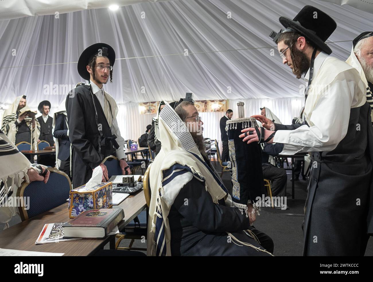 After a Torah reading the scroll is lifted, shown to the congregation ...