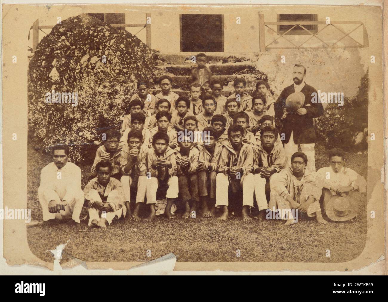 Group of boys and Reverend J.J.K. Hutchin. From the album: Cook Islands ...
