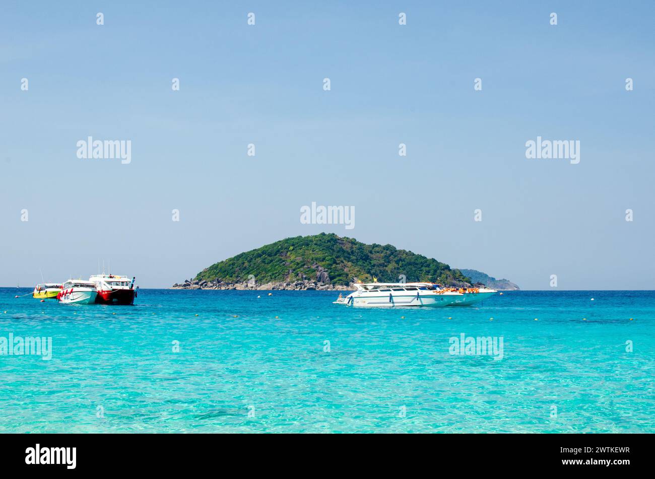 Tropical islands of ocean blue sea water and white sand beach at ...