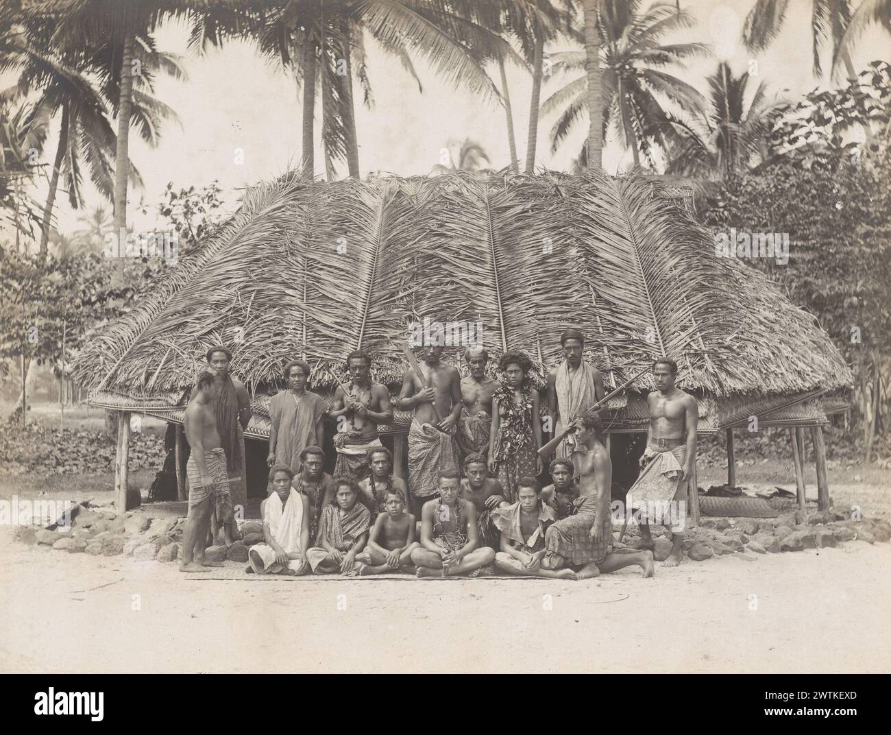 Group of people with a fale. From the album: Photographs of Apia, Samoa ...
