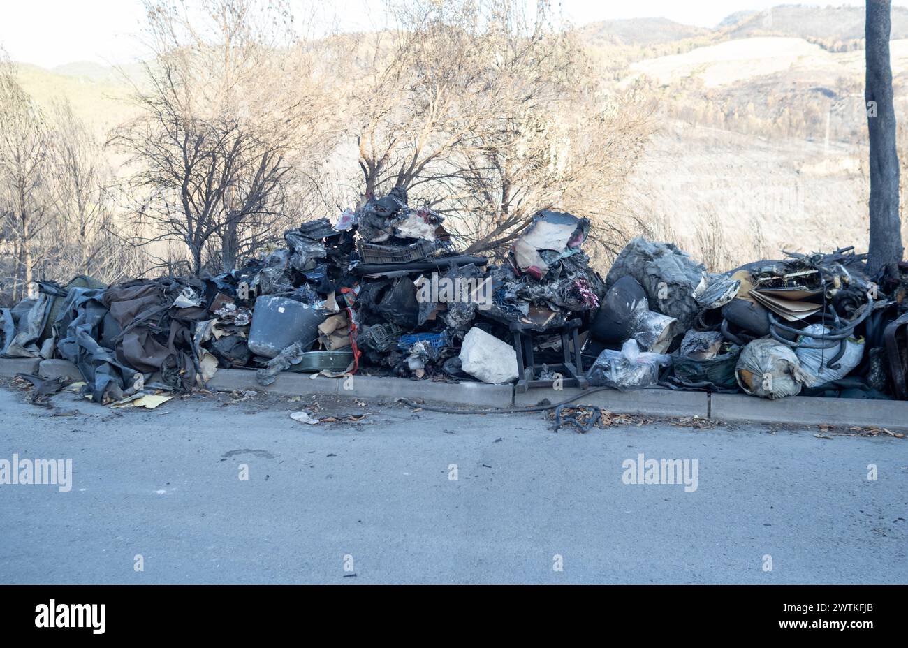 Detail of charred and burned personal objects after a house fire in ...
