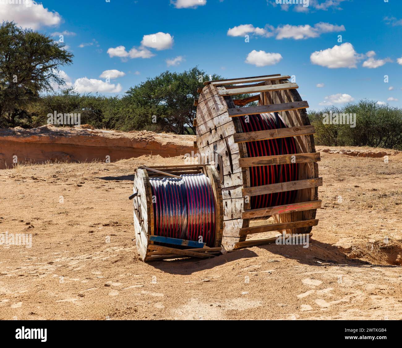 huge roll of industrial cable on a construction site in a sunny summer ...