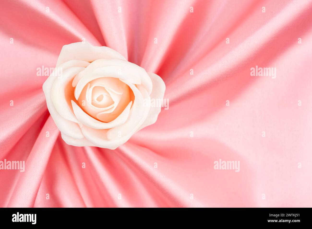 Pink color satin fabric texture background with rose flower Stock Photo ...