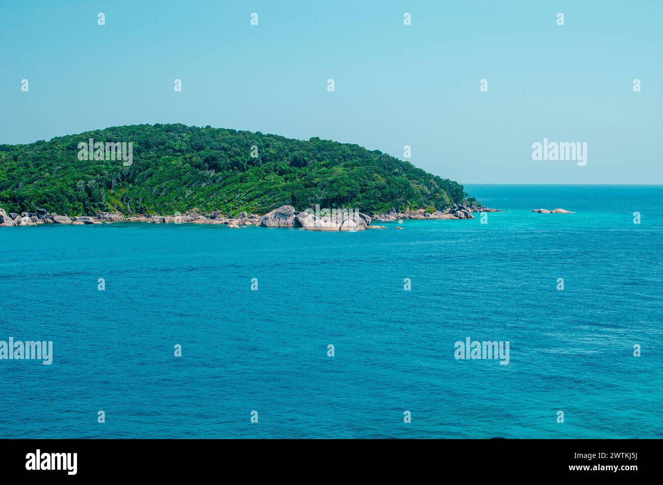 Tropical islands of ocean blue sea water and white sand beach at ...