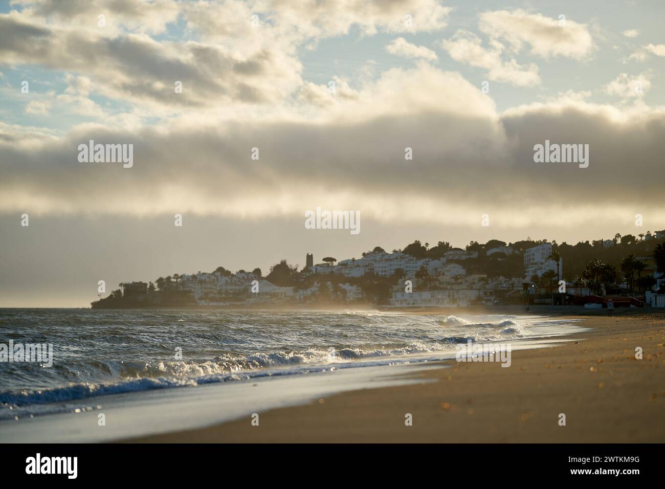 Spain Andalusia evening coast beach line waves on sand Stock Photo - Alamy