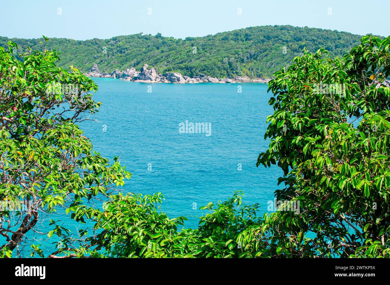 Tropical islands of ocean blue sea water and white sand beach at ...