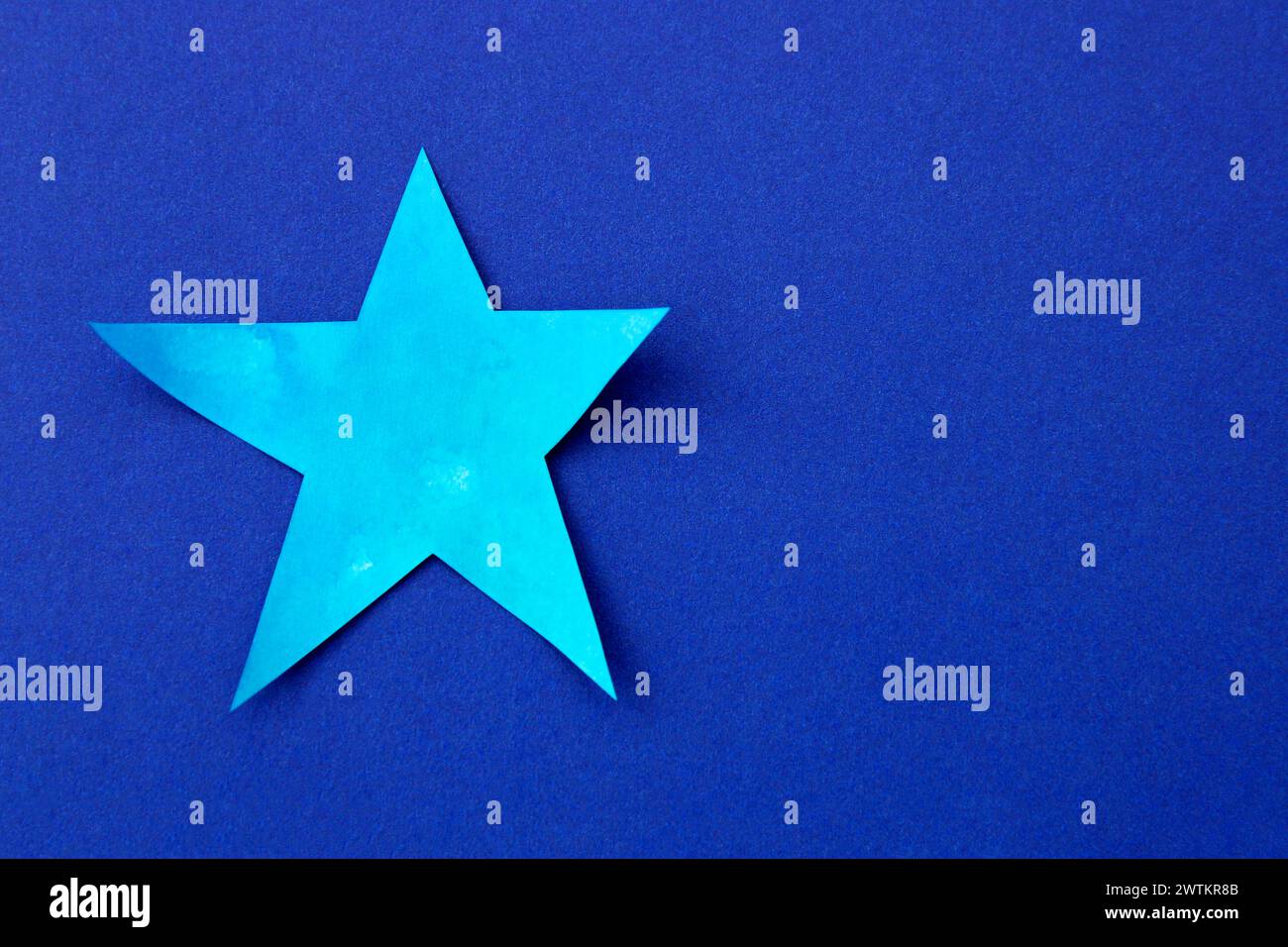 Celestial star on deep blue background Stock Photo - Alamy