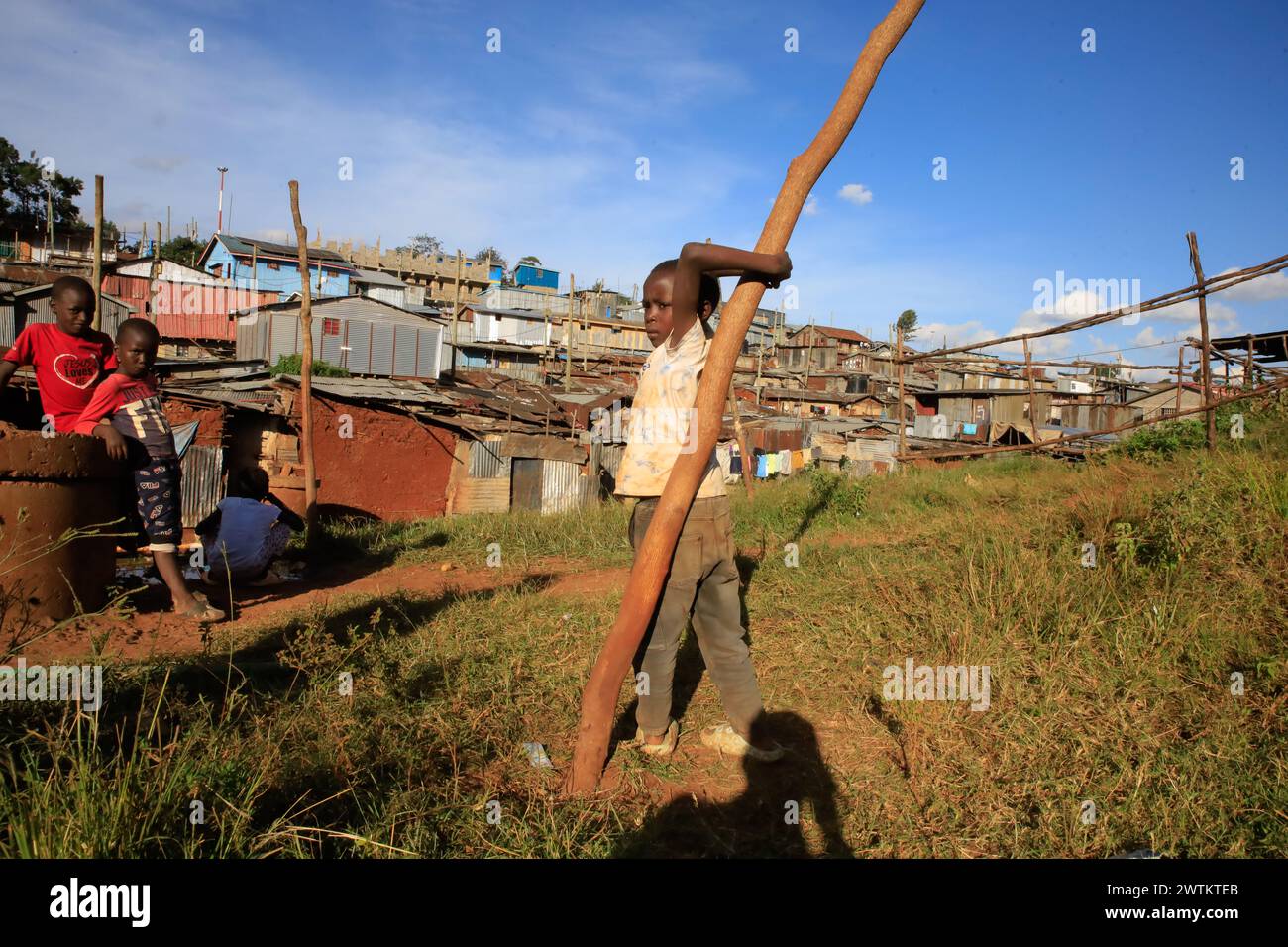 Young kids playing at a local field in Kibera Slum. Kibera, the largest ...