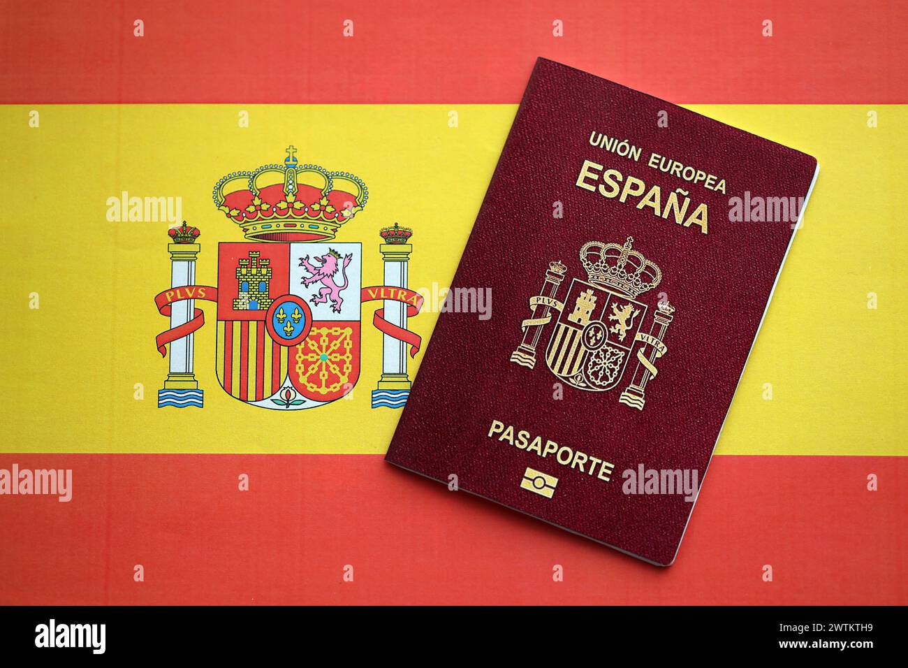 Red Spanish passport of European Union on national flag background ...