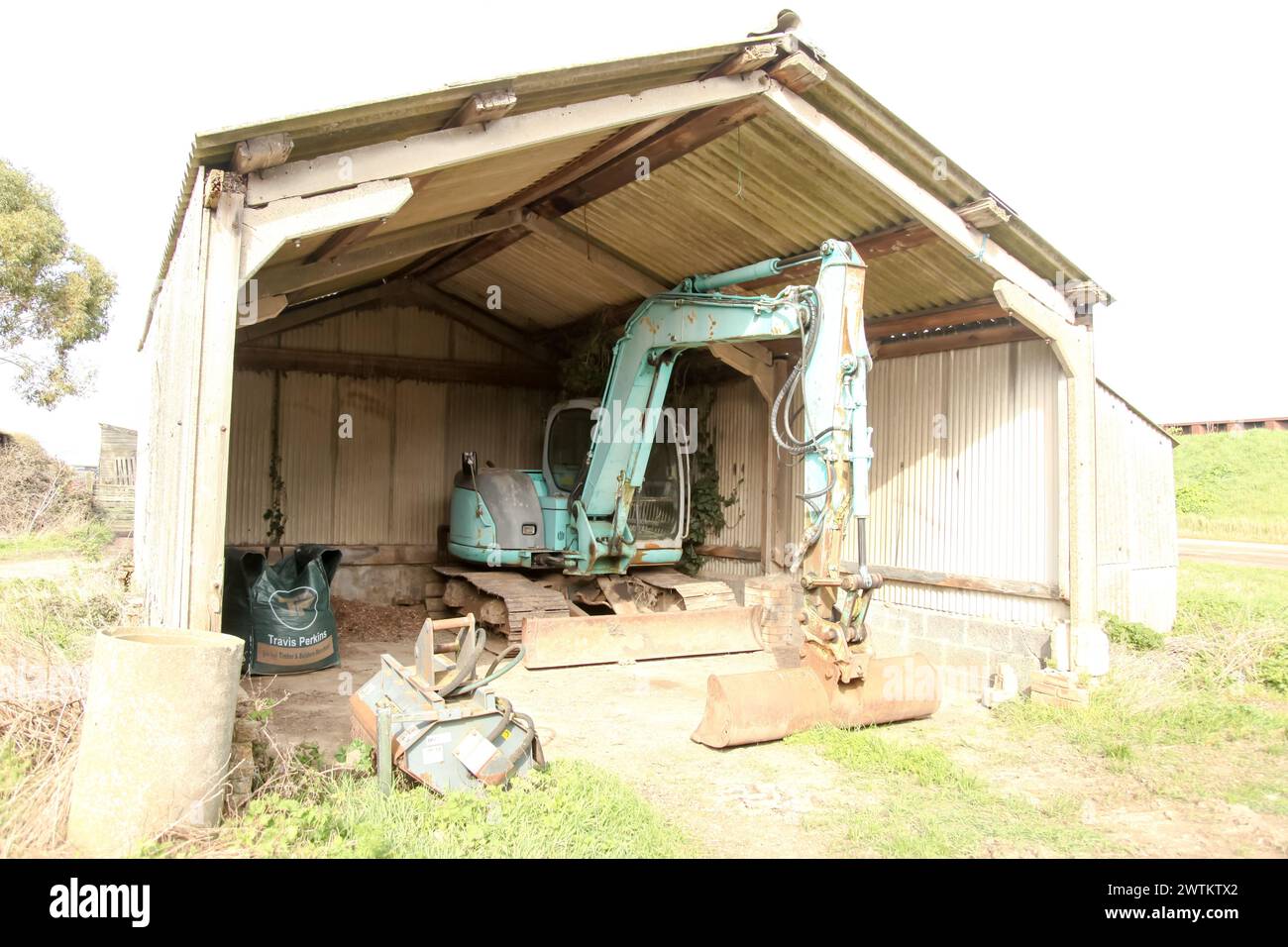 Industrial farm equipment, digger in barn, Great Wakering, Essex ...