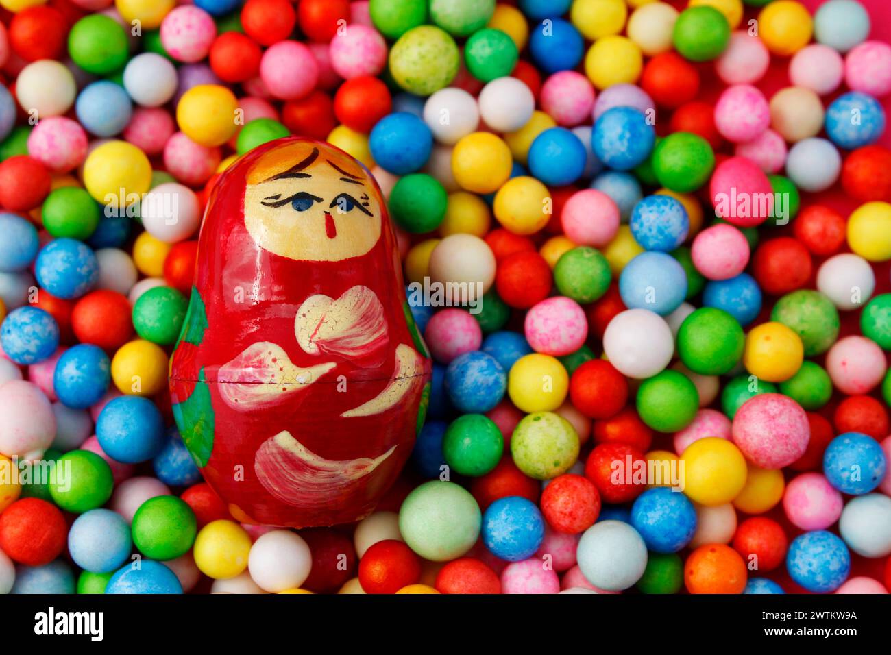 Matryoshka, Russian doll surrounded by colorful spheres Stock Photo - Alamy