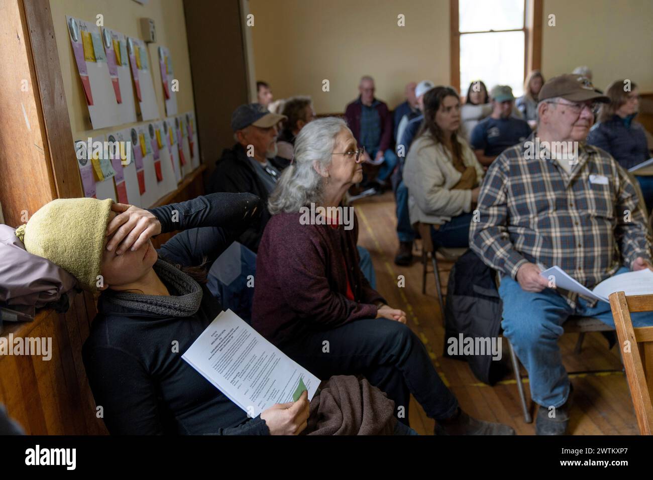 Resident Kate Sprague, left, wipes her eyes during the annual Town ...