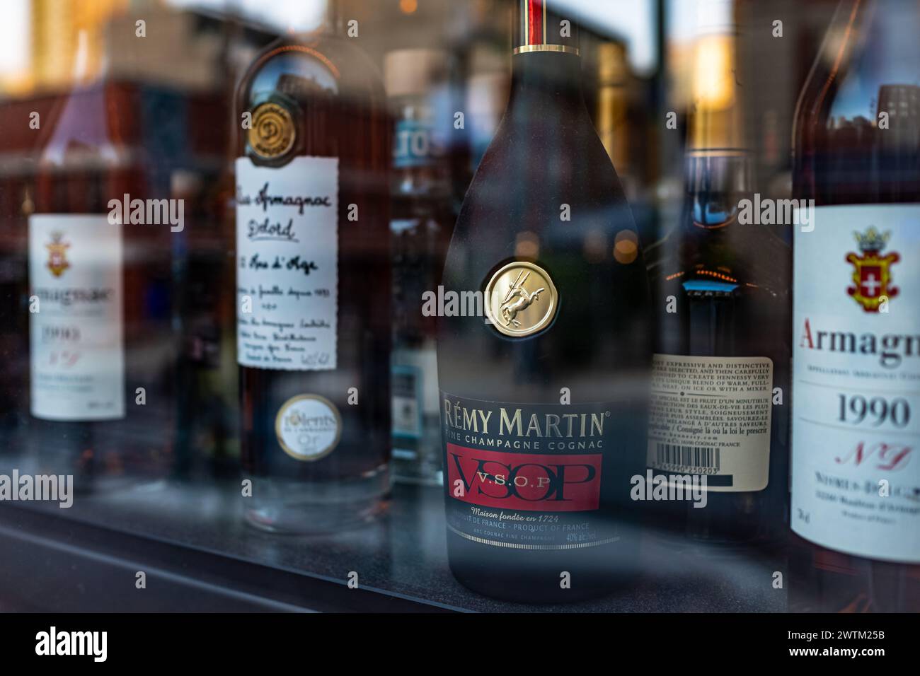 Different bottles of alcohol are displayed on shelves of store. Various ... Different bottles of alcohol are displayed on shelves of store. Various ...