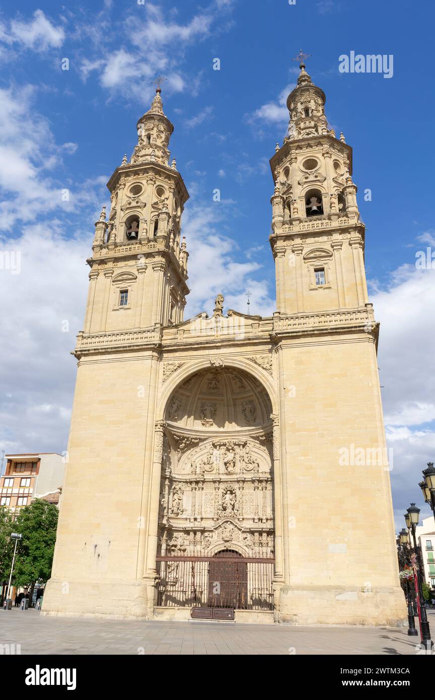 The two tall buildings are made of stone and have a large arch in the ...