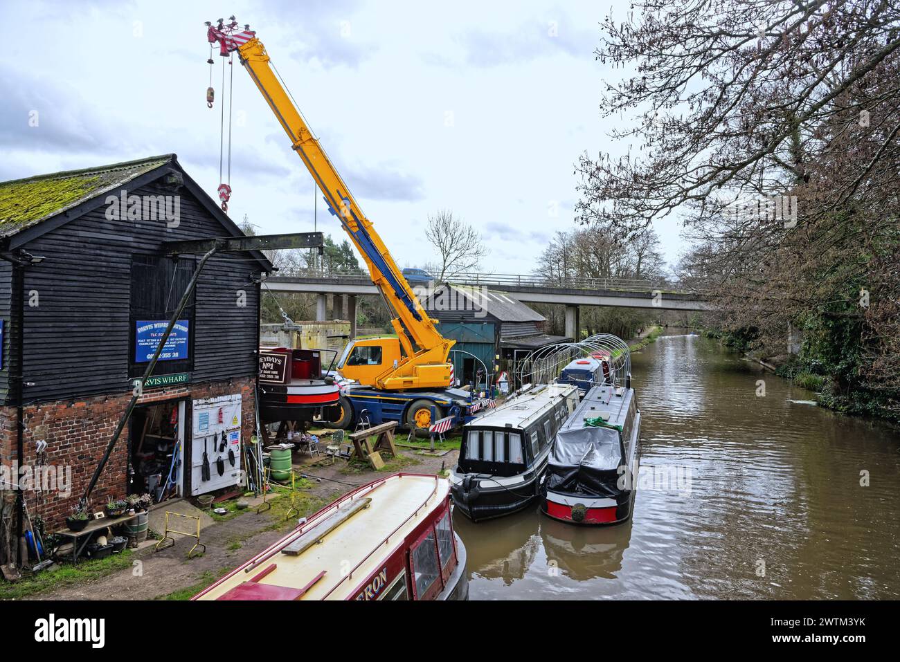 The Parvis Wharf Boatyard with a large lifting crane on the River Wey ...