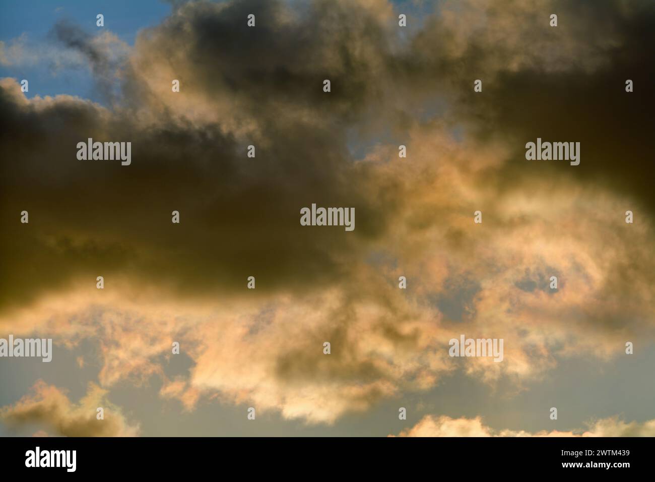 Dramatic cloud formation illuminated by a winter sunset Stock Photo - Alamy