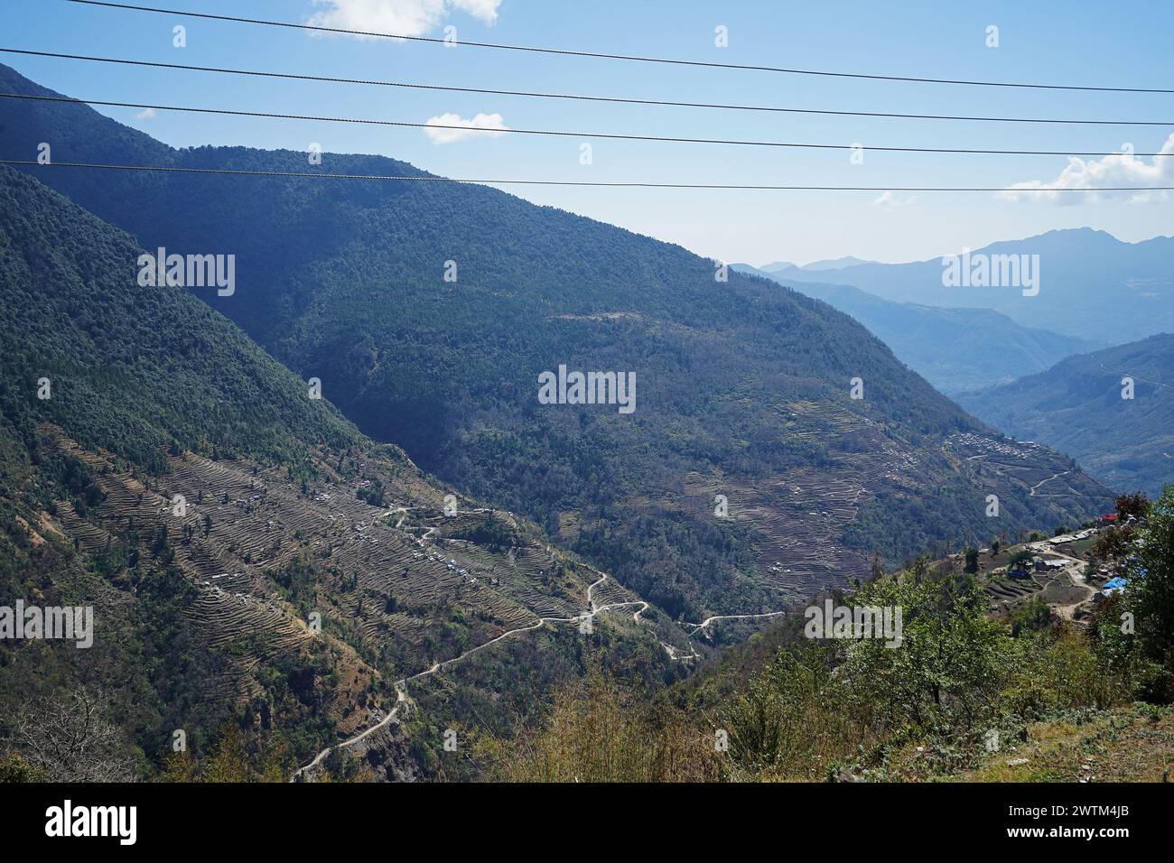 Natural landscape of Tribal Nepali village among green mountain range ...