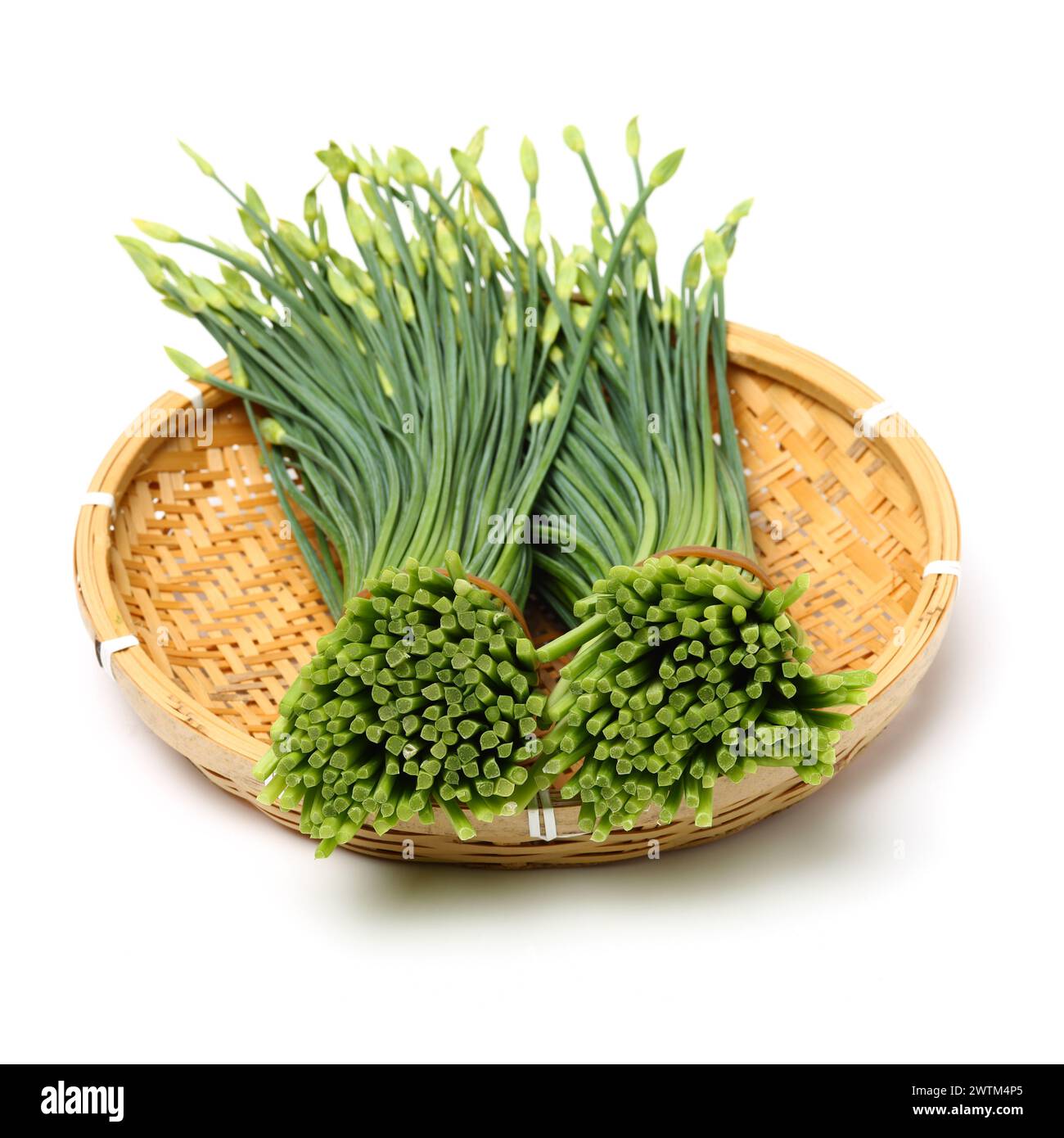 a bunch of flowering chinese garlic chives on the white background ...