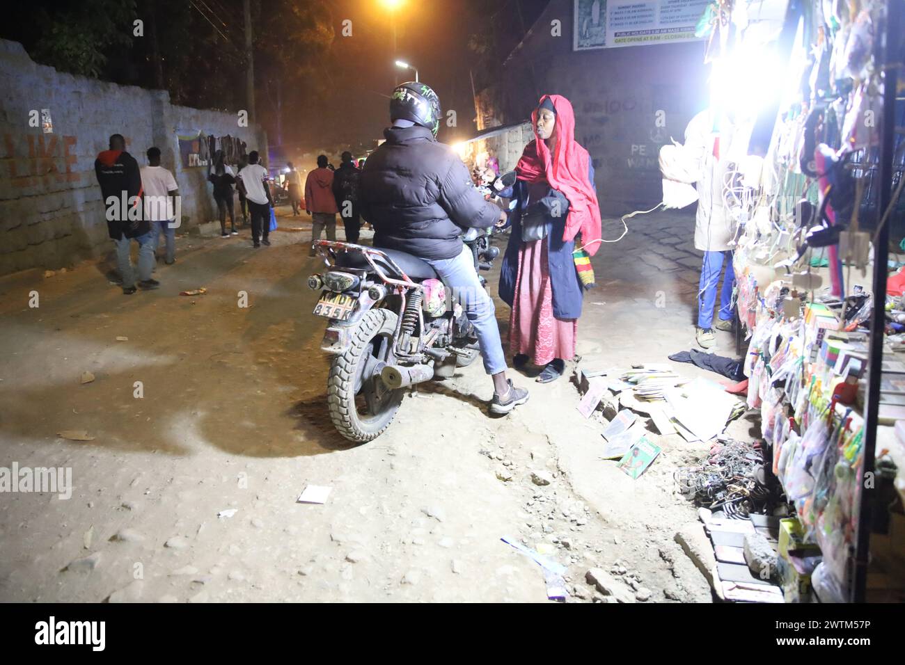 Residents are having a late evening conversation by the busy streets of ...